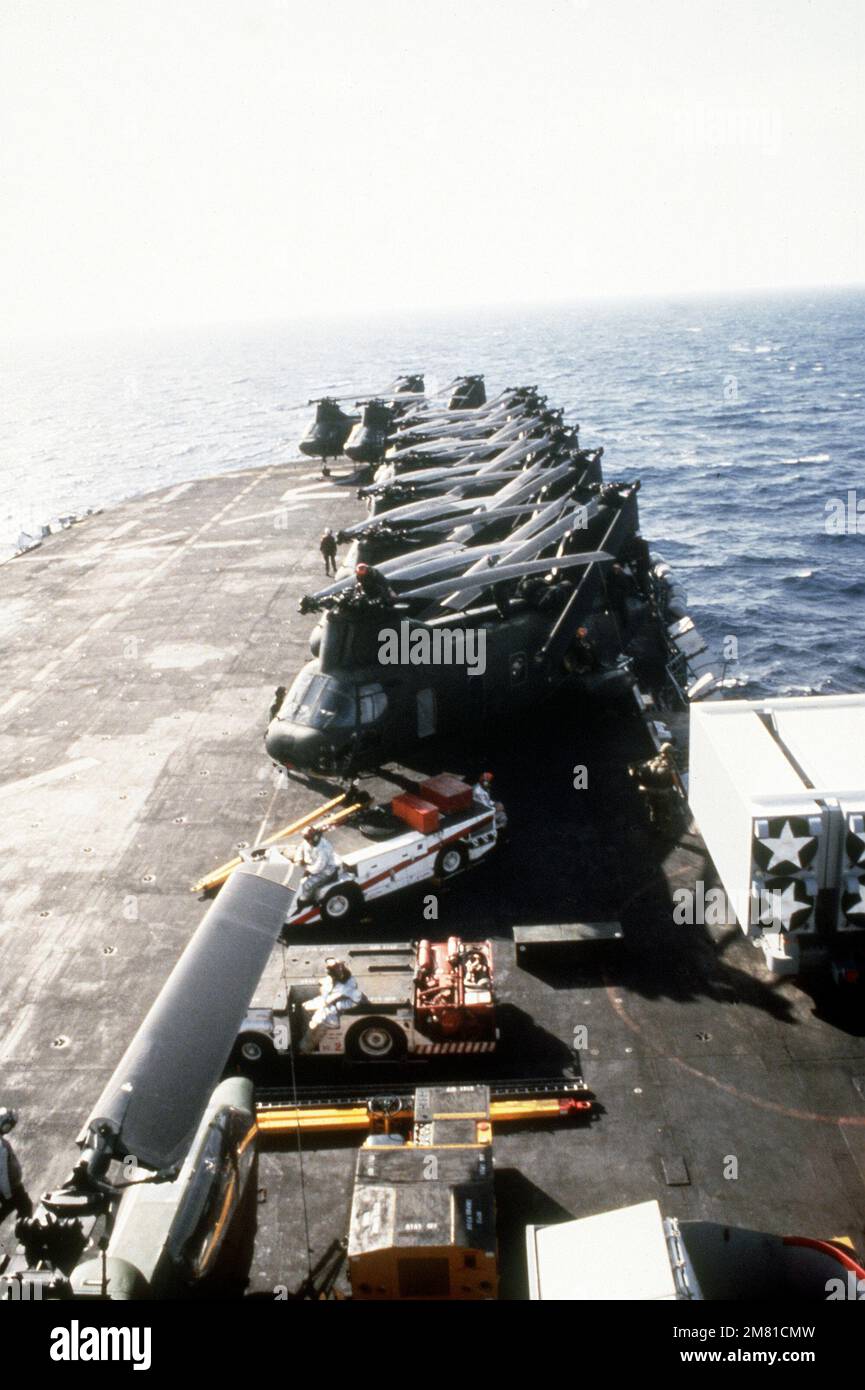 CH-46 Sea Knight helicopters parked on the forward flight deck of the ...