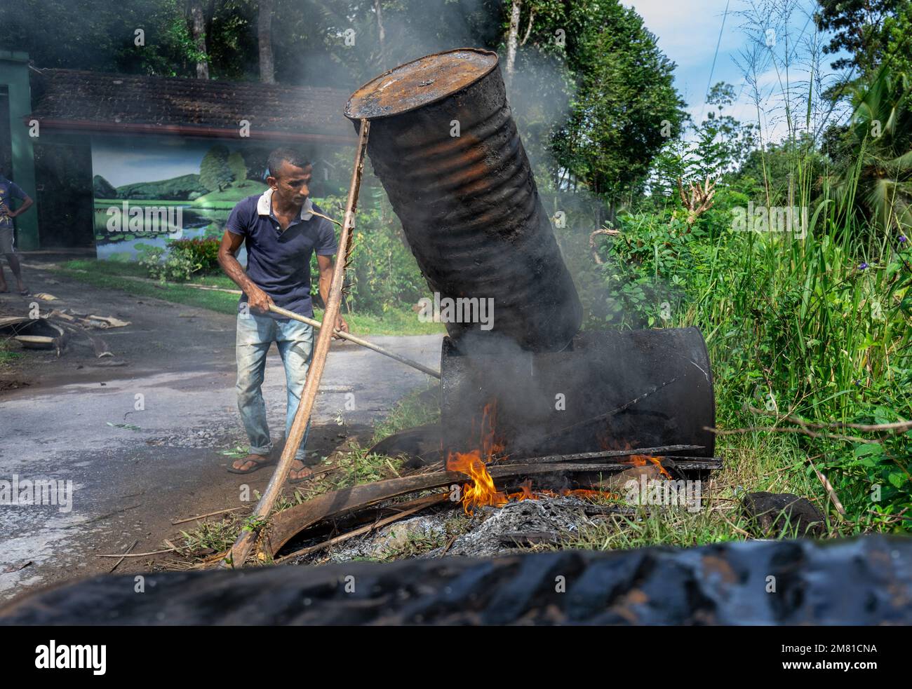Traditional Labour Heating up tar and pouring to Road landscape on 2022 ...
