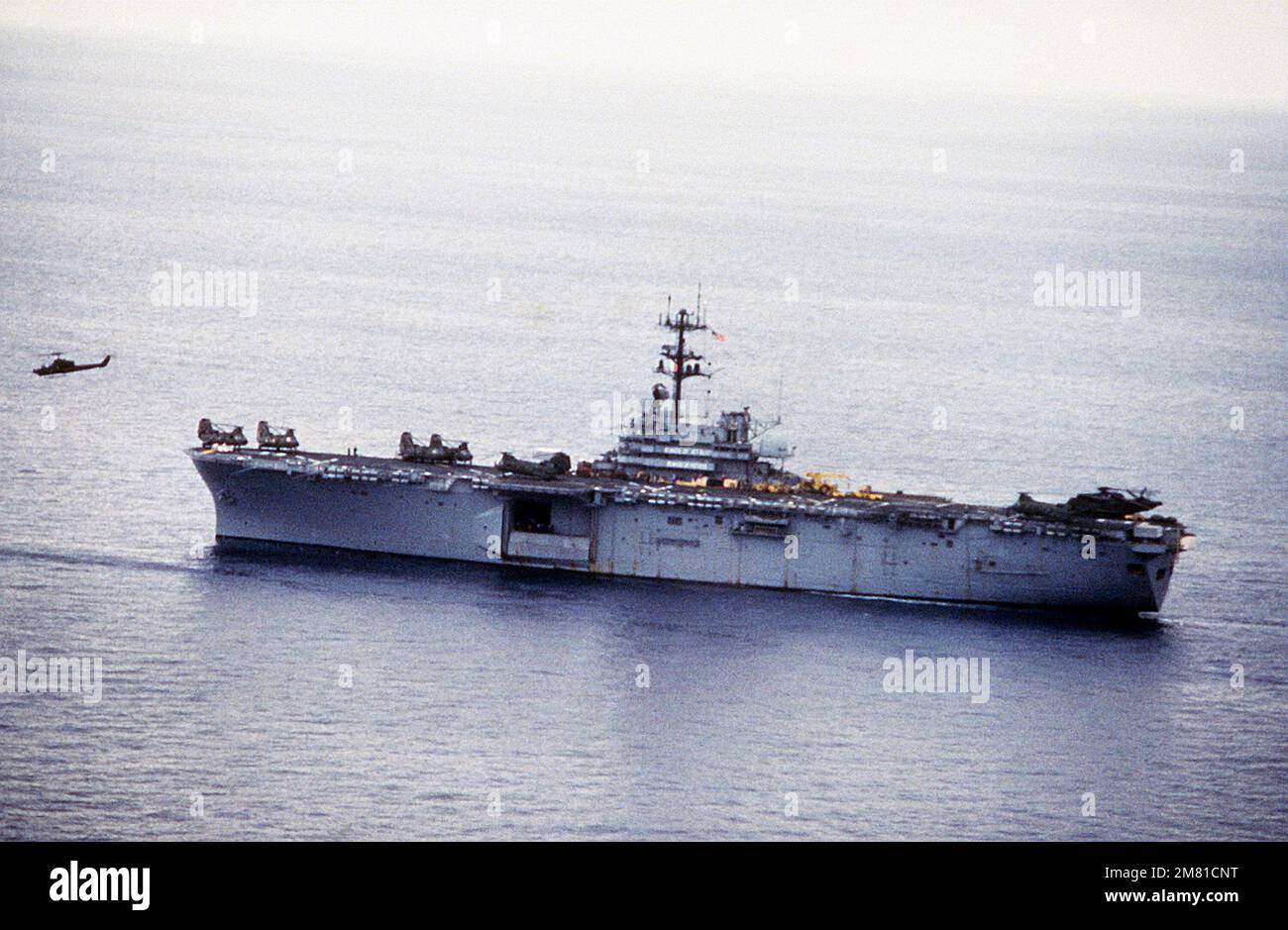 A port beam view of the amphibious assault ship USS GUAM (LPH-9) during ...