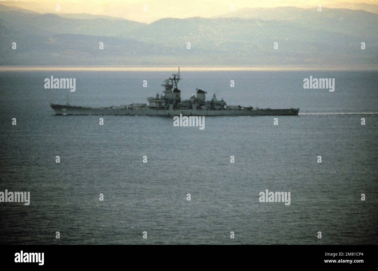 A port beam view of the battleship USS NEW JERSEY (BB 62) underway ...
