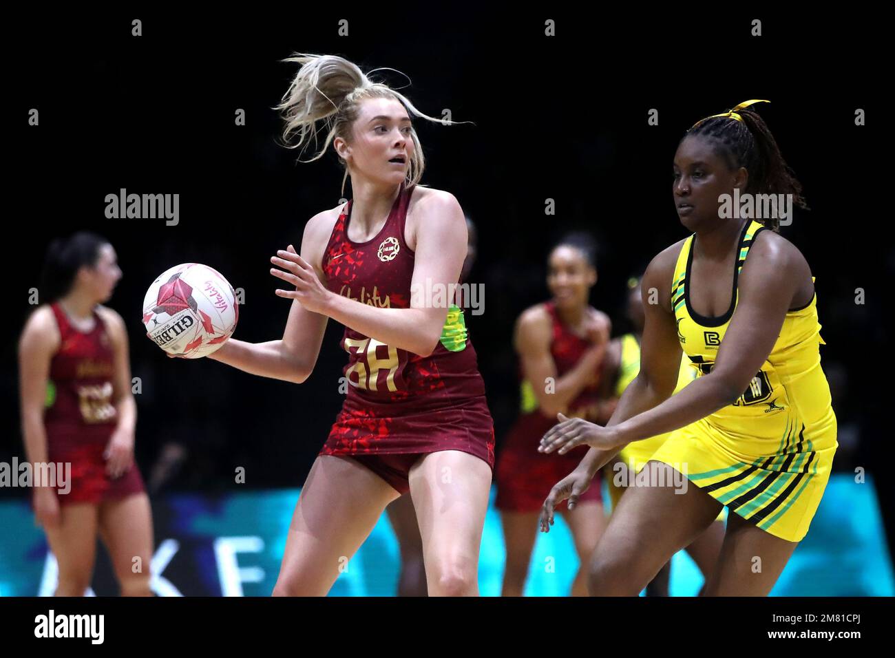 England's Helen Housby (left) and Jamaica's Malysha Kelly in action ...