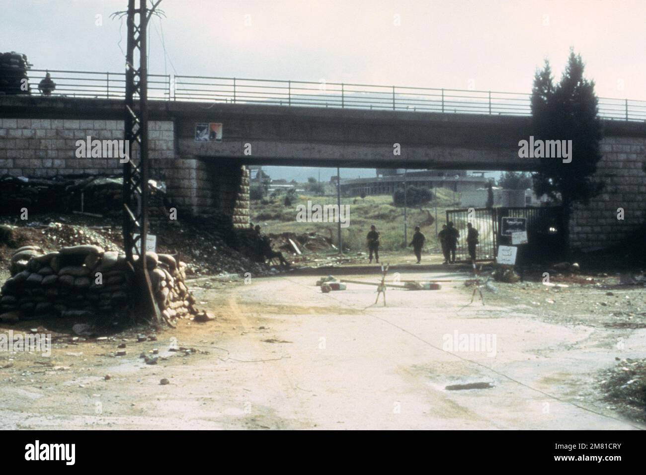 A view taken from a bunker position of Marines patrolling an area under ...
