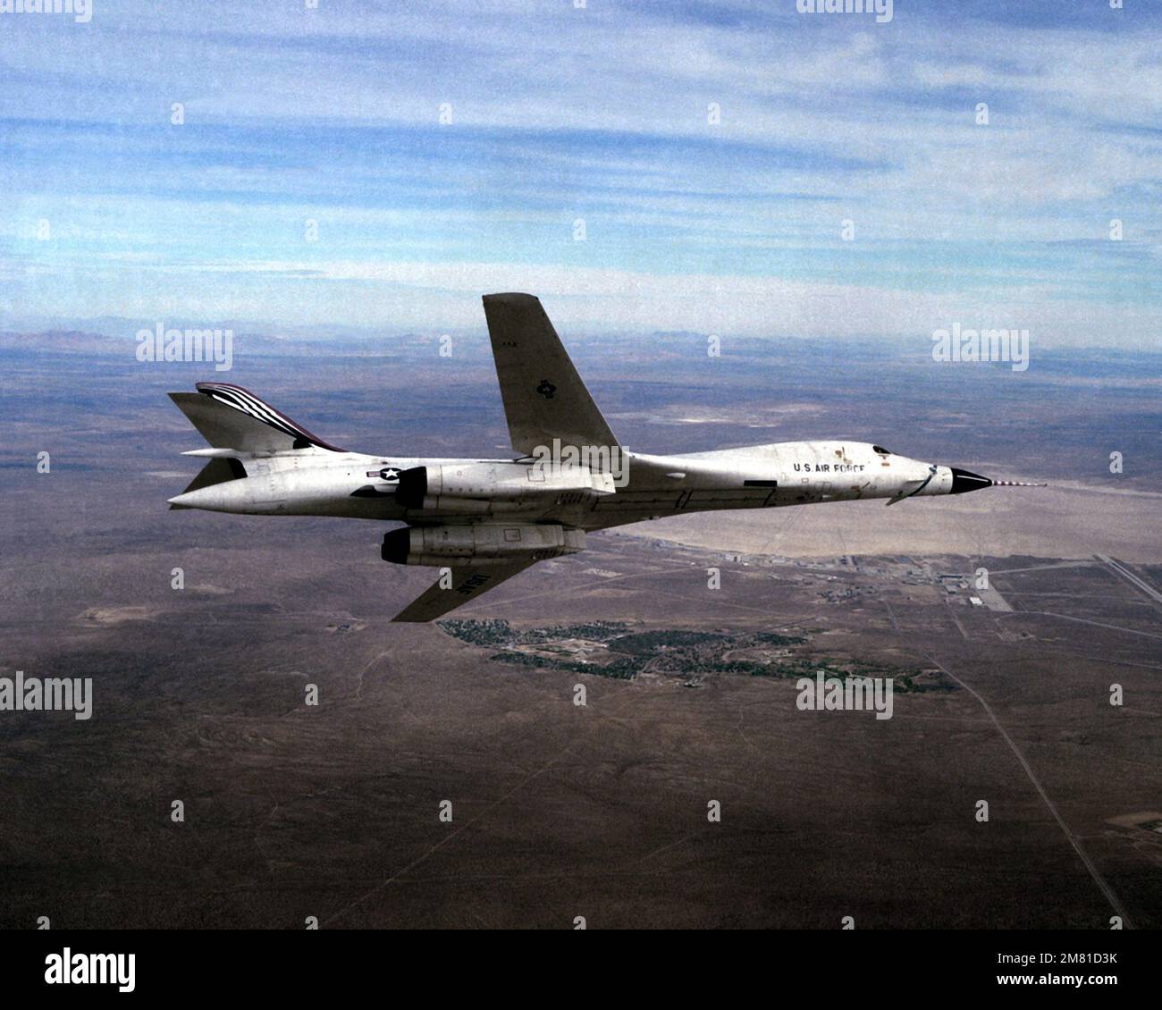 An air-to-air right side view of the B-1B test program aircraft banking ...