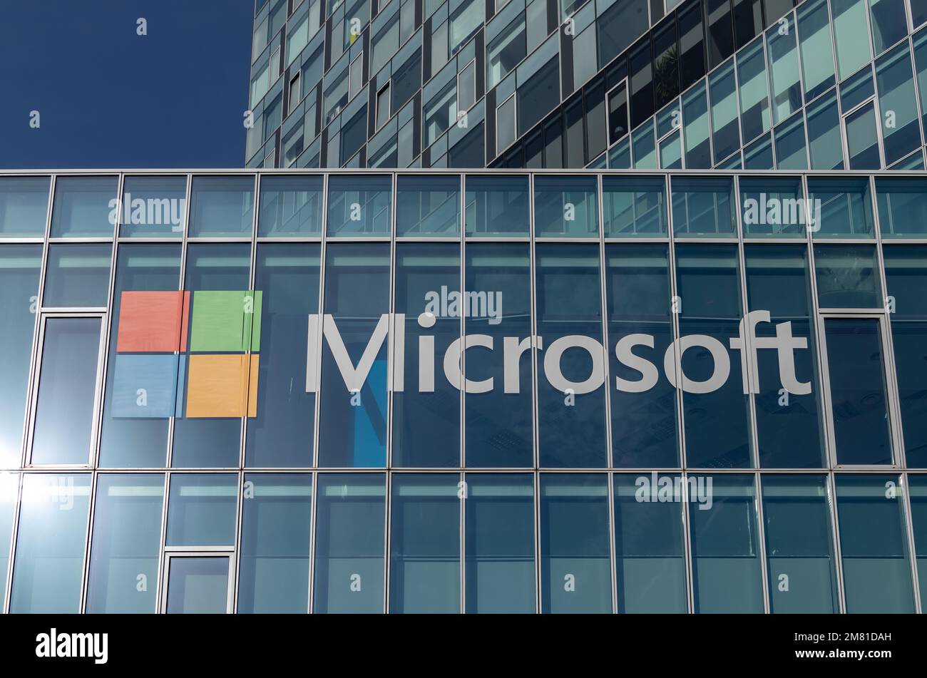 A picture of the Microsoft logo on an office building, in Bucharest ...