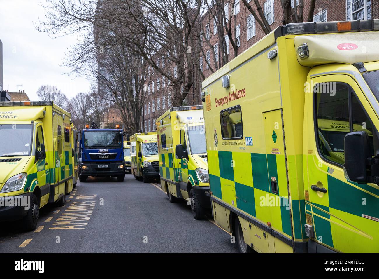 London, UK. 11 January, 2023. Ambulances are pictured lined up outside ...