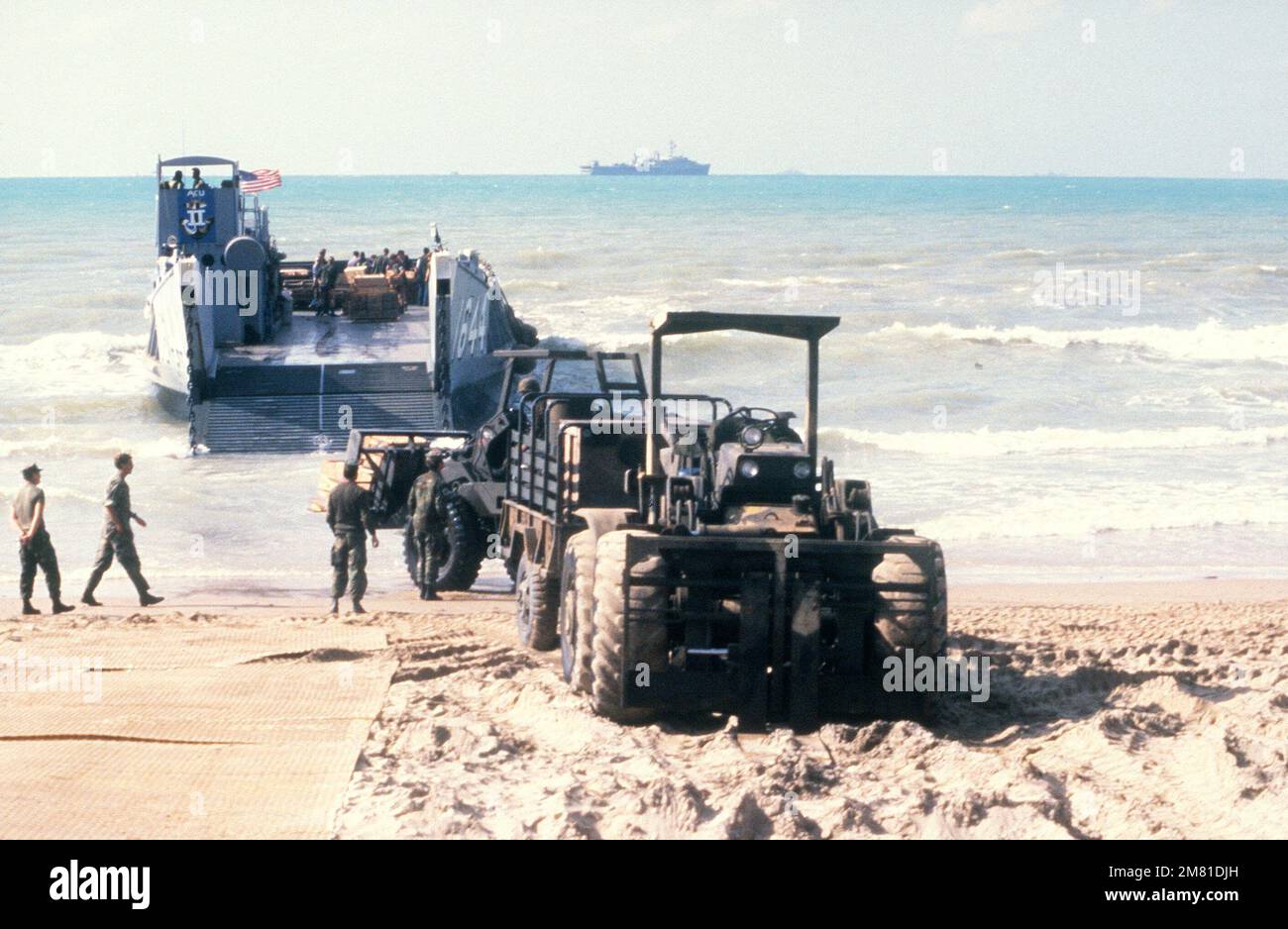 Marine beachmasters use a TEREX 72-31MP2U/R forklift to load equipment ...