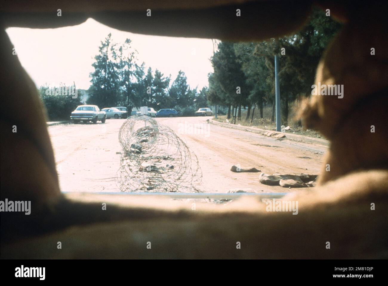 A view from inside a bunker as Marines observe the road leading into a ...