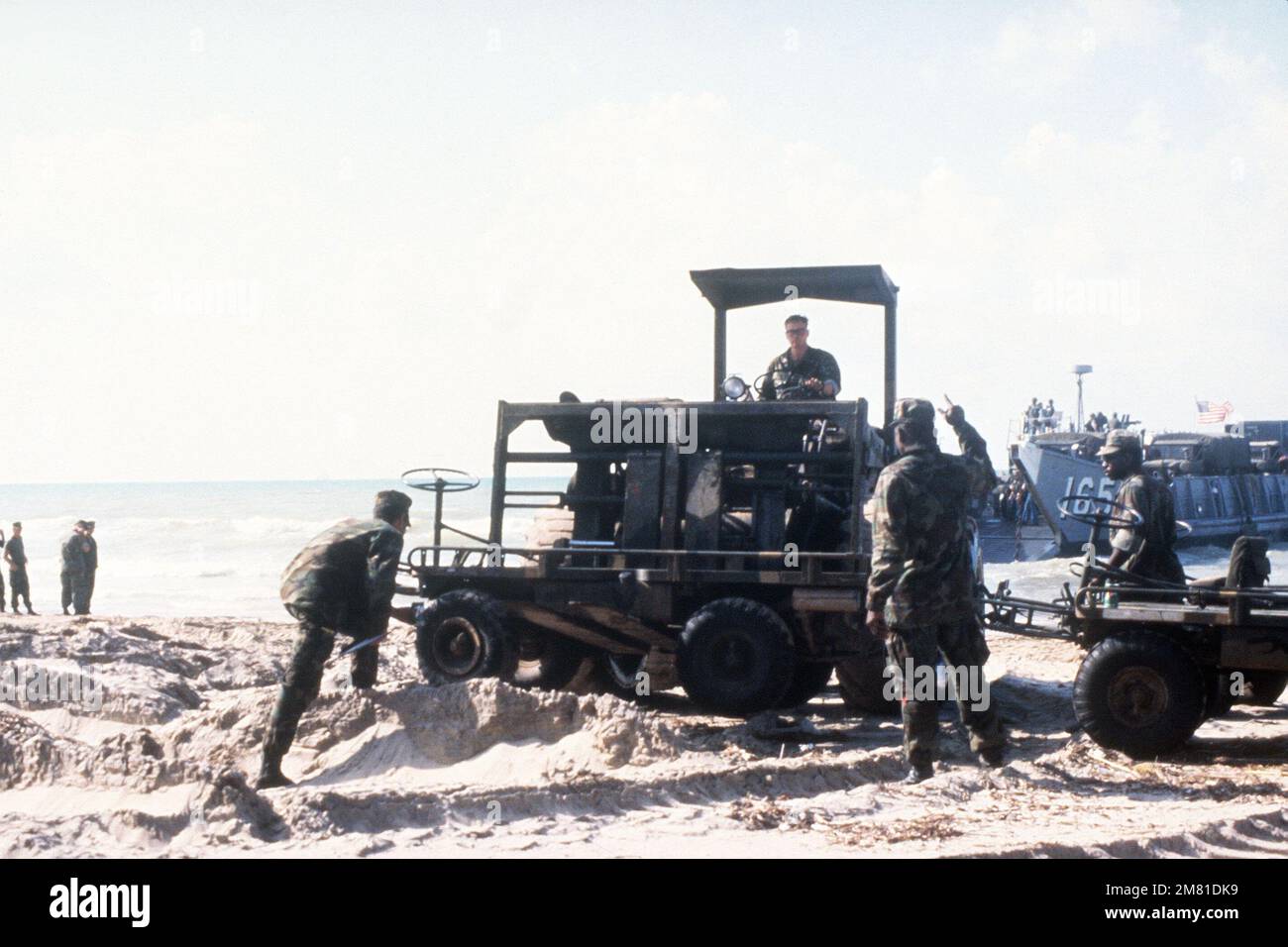 Marine beachmasters use a TEREX 72-31MP2U/R forklift to load a vehicle ...