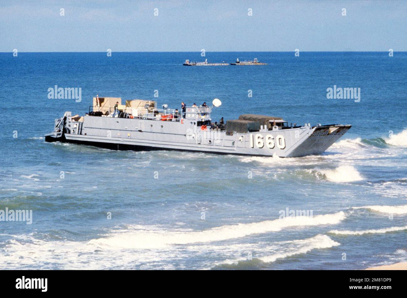 Utility landing craft 1660 (LCU 1660) lands at Green Beach during a ...