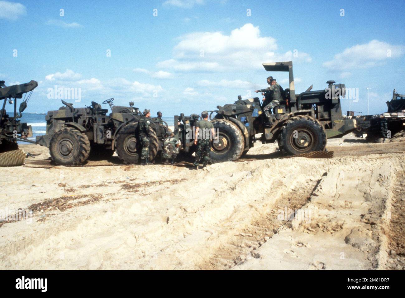 Marine beachmasters use a TEREX 72-31MP2U/R forklift to load equipment ...