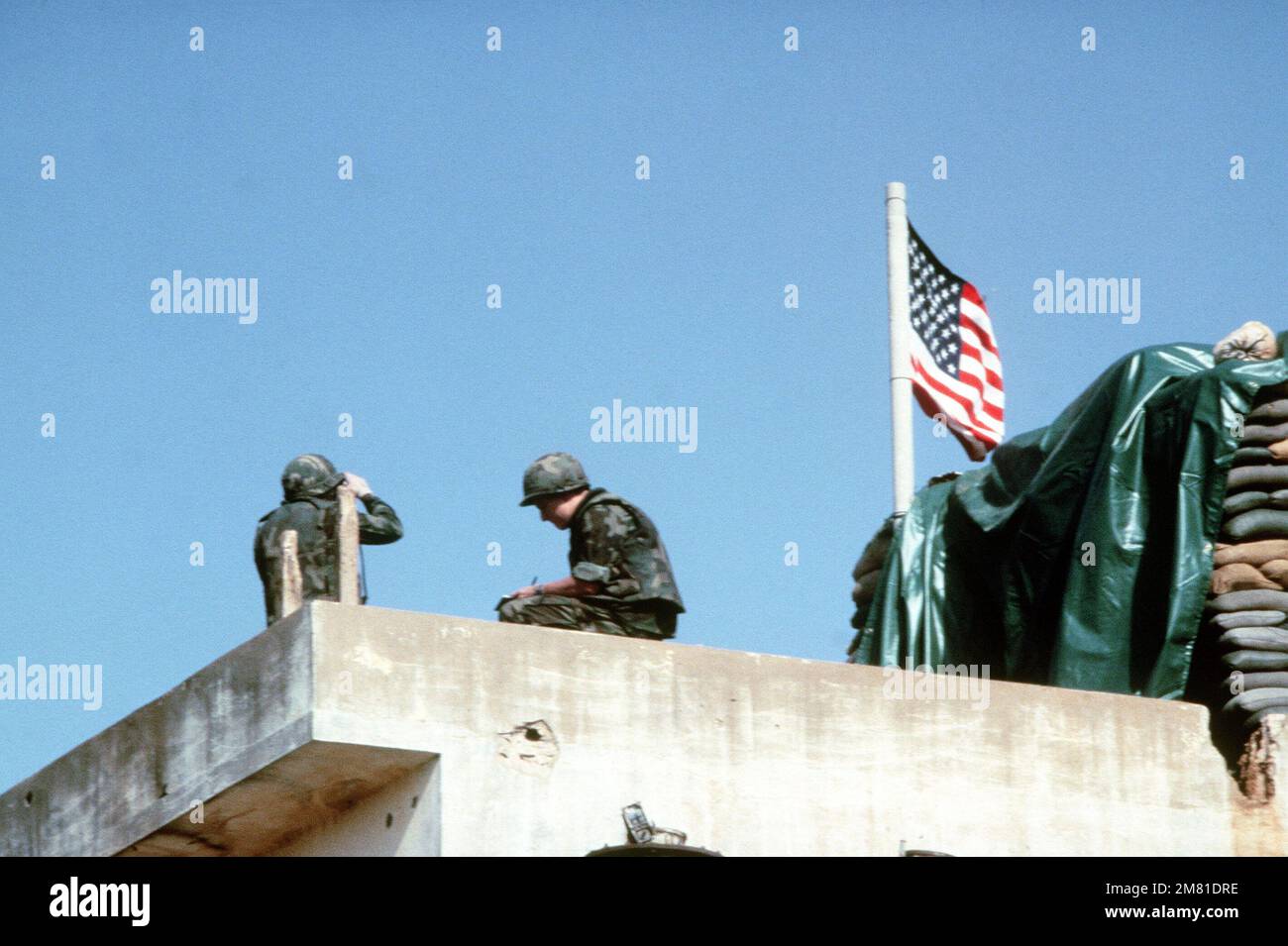 Marines observe the surrounding area from their bunker position above ...