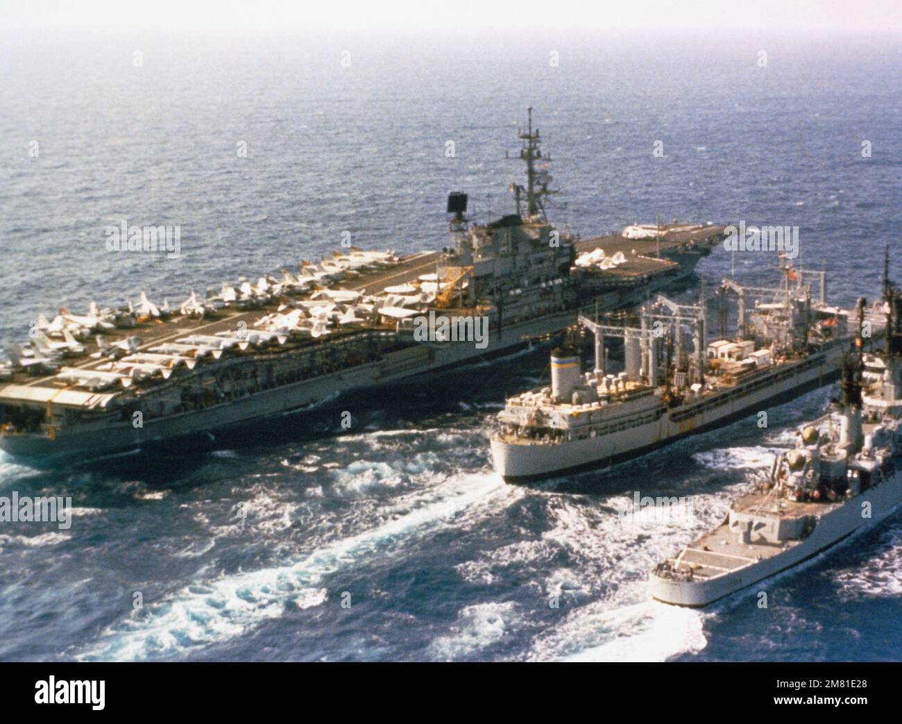 An elevated starboard quarter view of the oiler USNS NAVASOTA (T-AO 106 ...