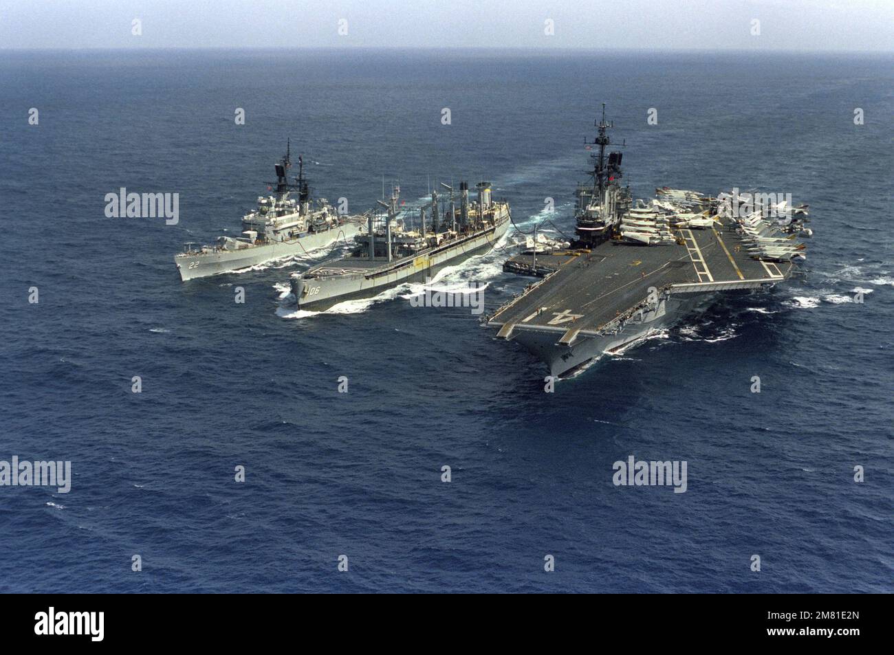 An elevated port bow view of the oiler USNS NAVASTOA (T-AO 106 ...