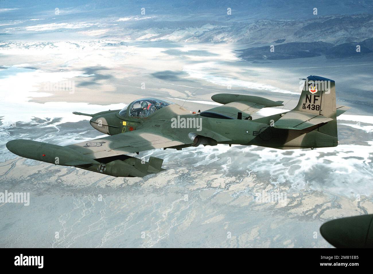 An air-to-air left side view of an A-37 Dragonfly aircraft. Base ...