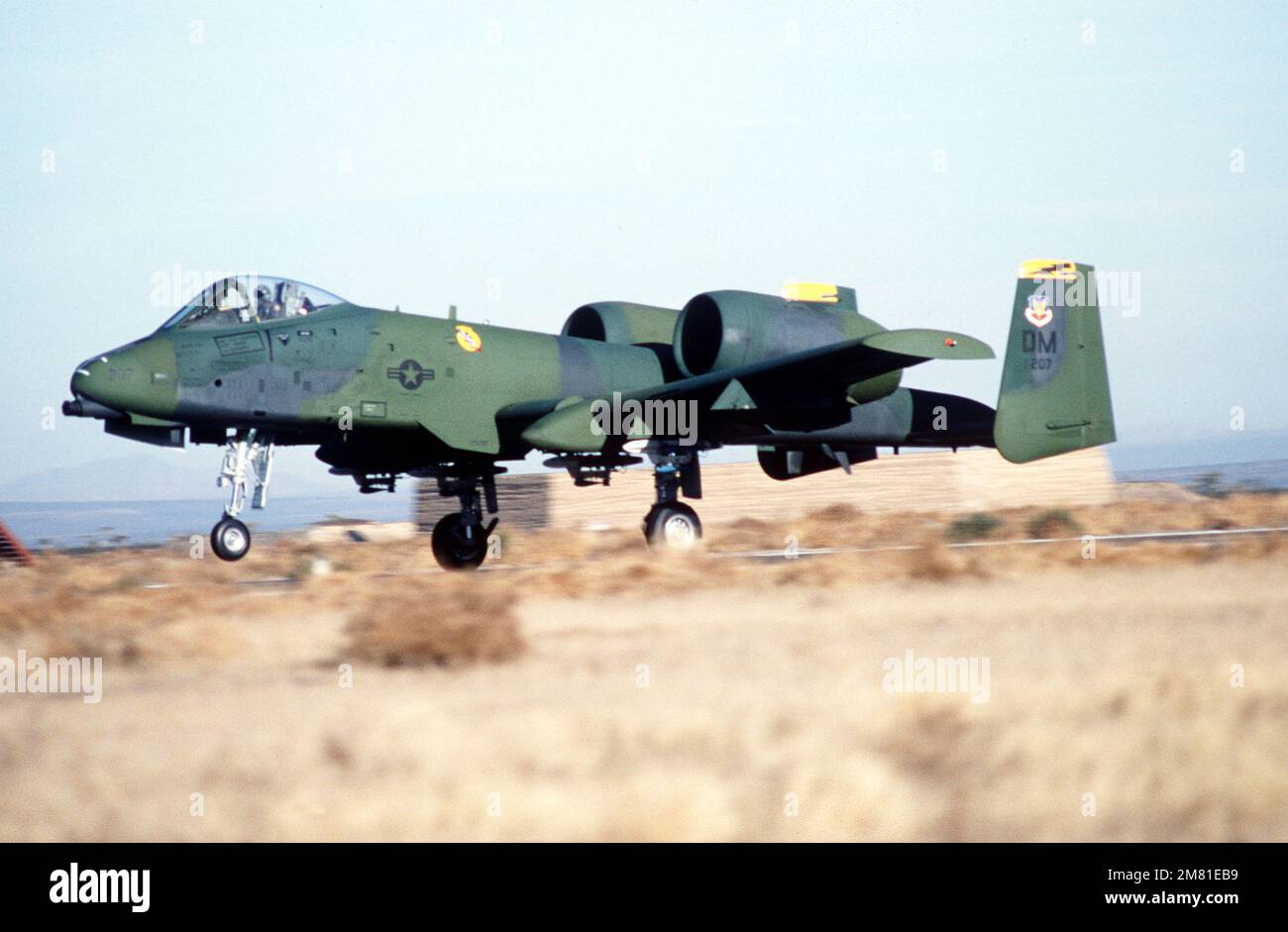 Left side view of an A-10 Thunderbolt II aircraft landing. Base: George ...
