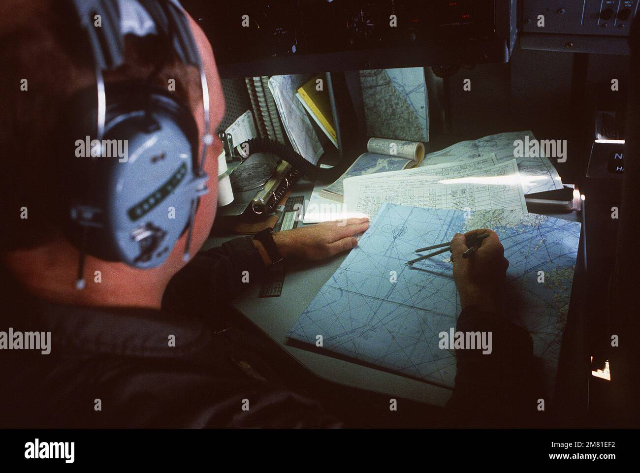 CAPT. Donald E. Link, navigator, plots the course for an Sentry ...