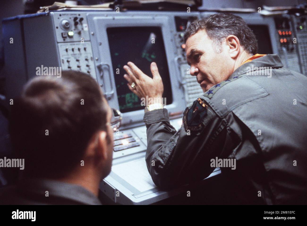 Captain Johnnie Schappachar (left), weapons director, gives General ...