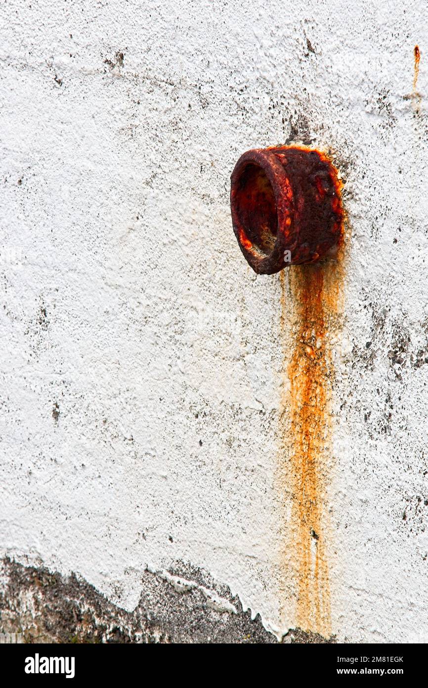 Crusty pipe protruding from the wall Stock Photo - Alamy