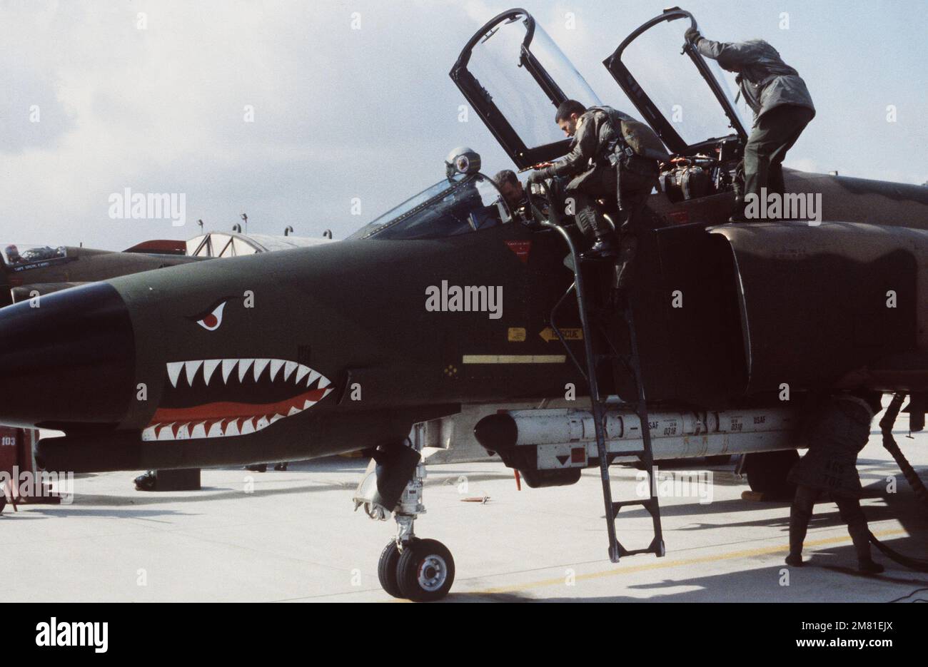 An F-4 Phantom II aircraft is prepared for takeoff during a tactical ...