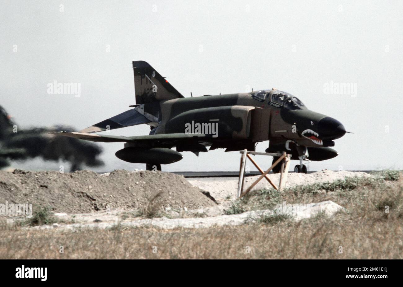 F-4 Phantom II aircraft taxi from the flight line for takeoff, during a ...