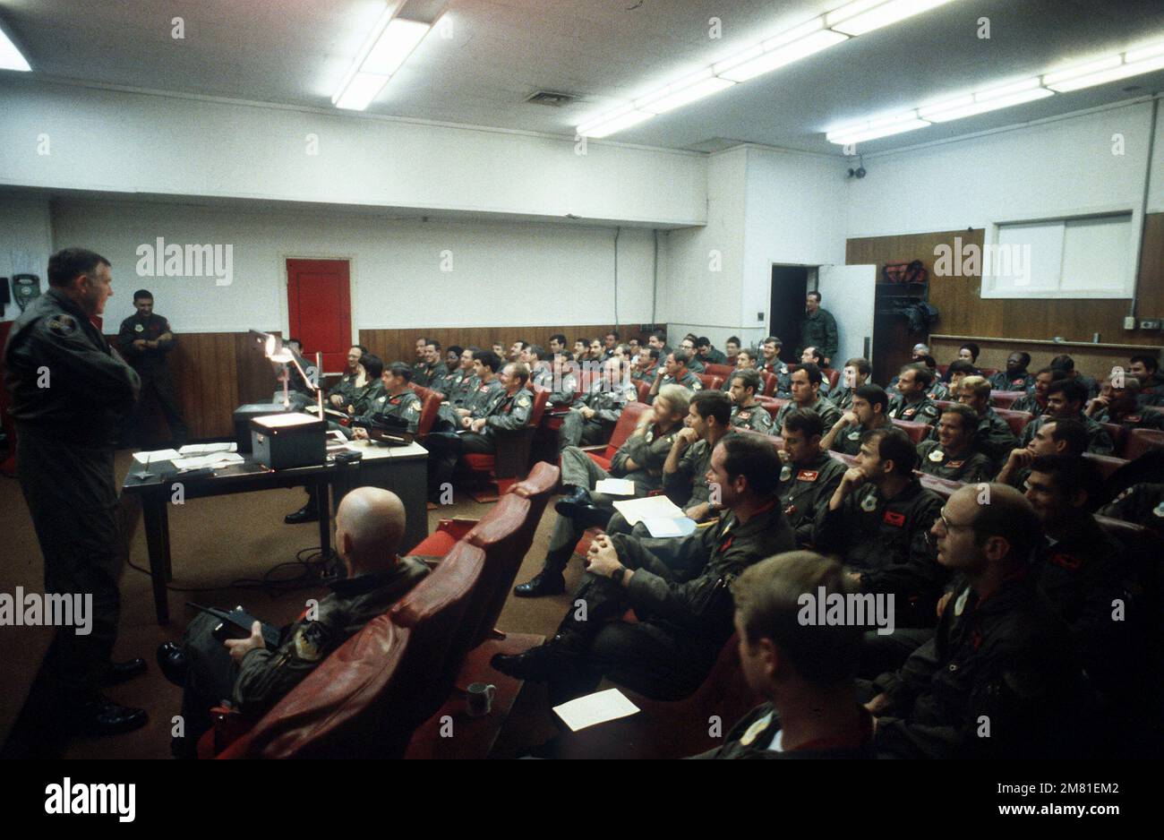 Colonel Barry J. Howard, 51st Tactical Fighter Wing Commander, briefs ...