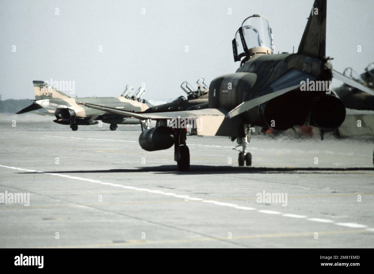 F-4 Phantom II aircraft taxi from the flight line for takeoff, during a ...