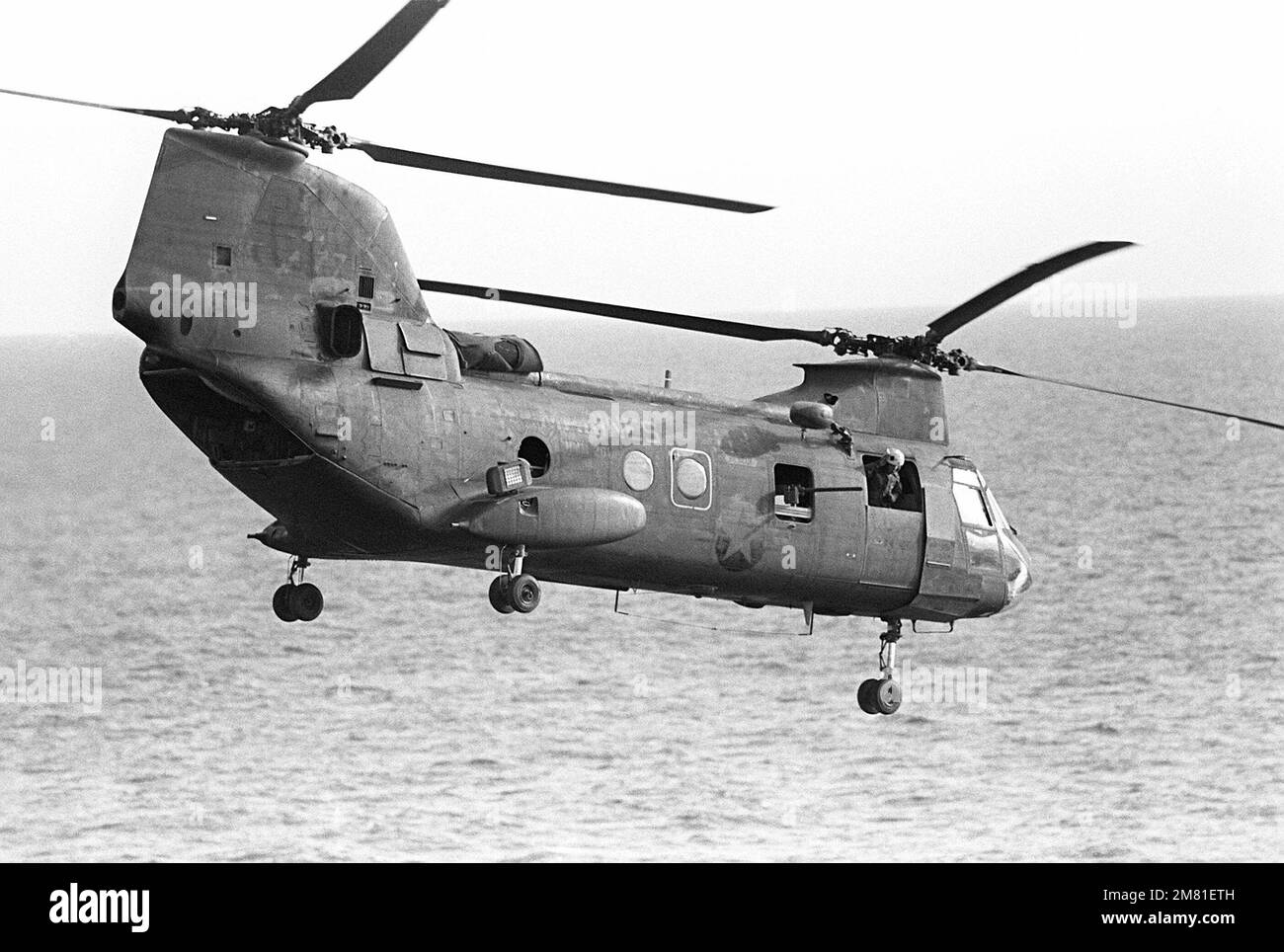 A CH-46 Sea Knight helicopter takes off from the flight deck of the ...