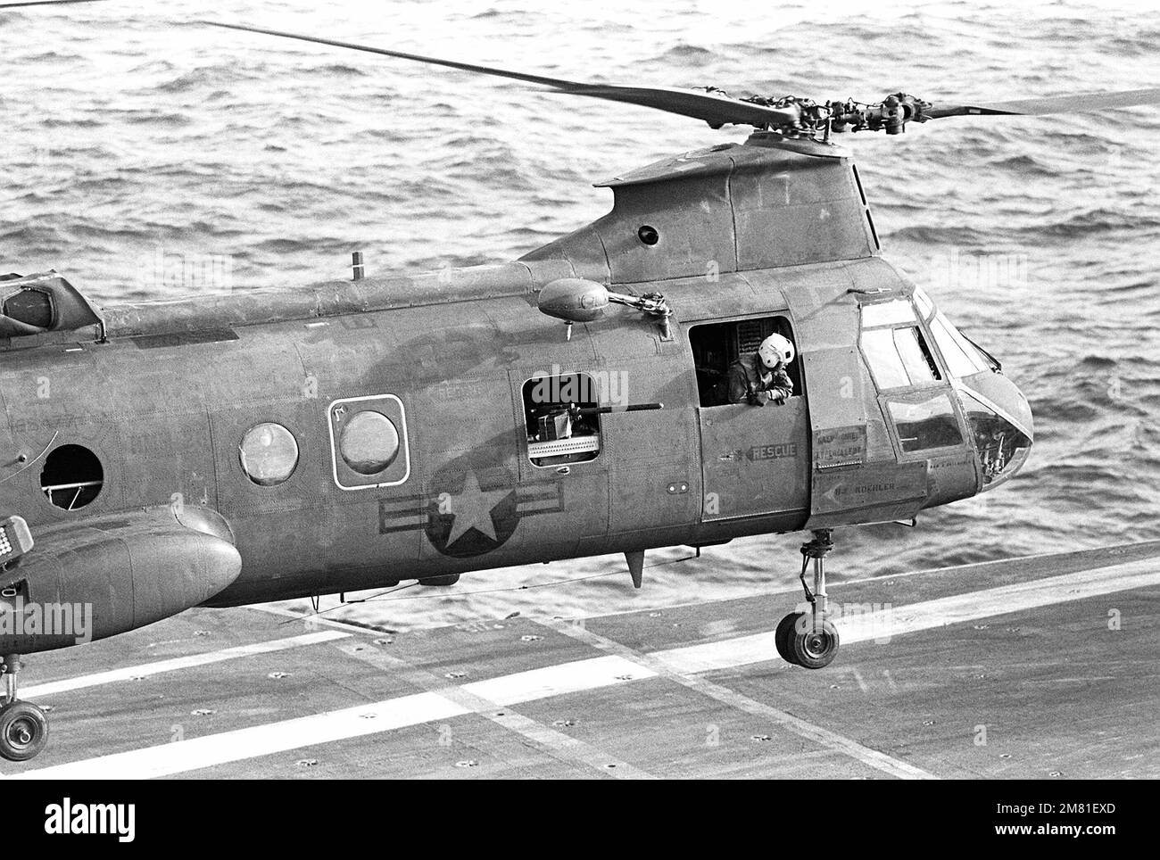 A CH-46 Sea Knight helicopter takes off from the flight deck of the ...