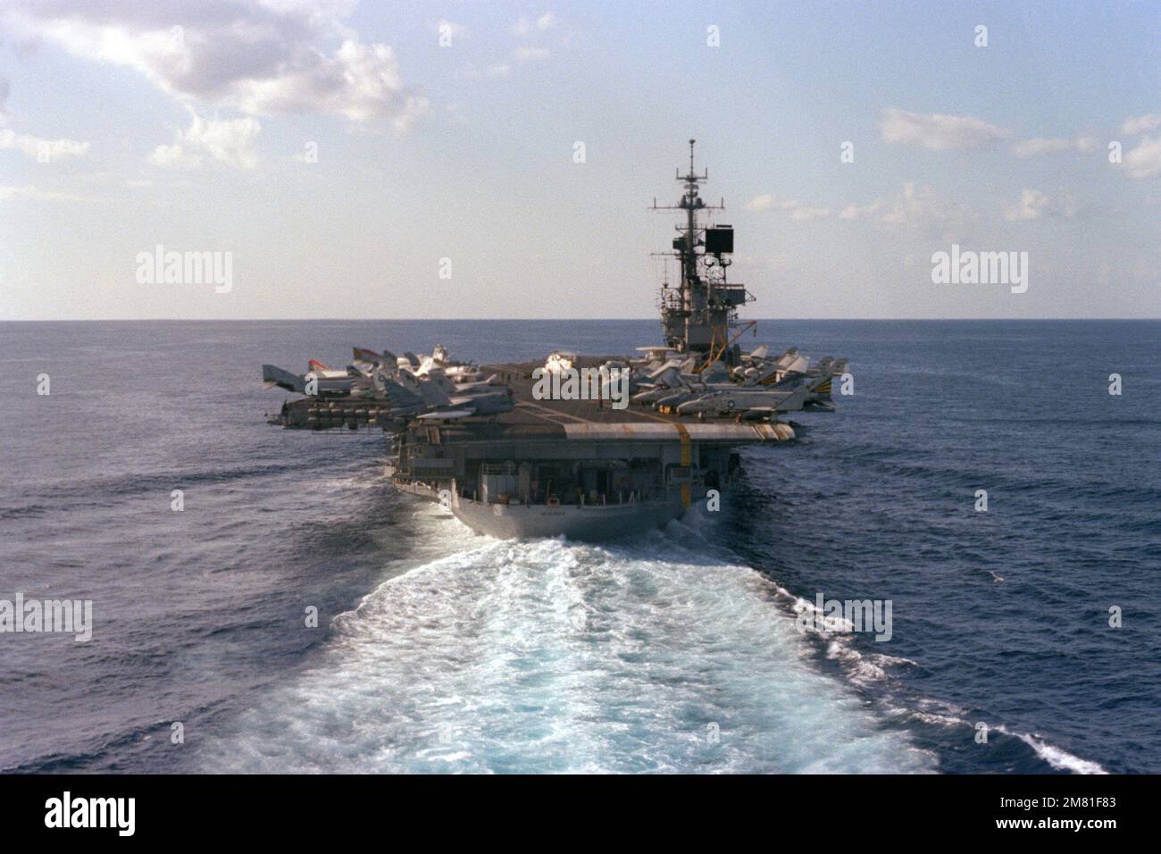 A stern view of the aircraft carrier USS MIDWAY (CV 41) underway off ...