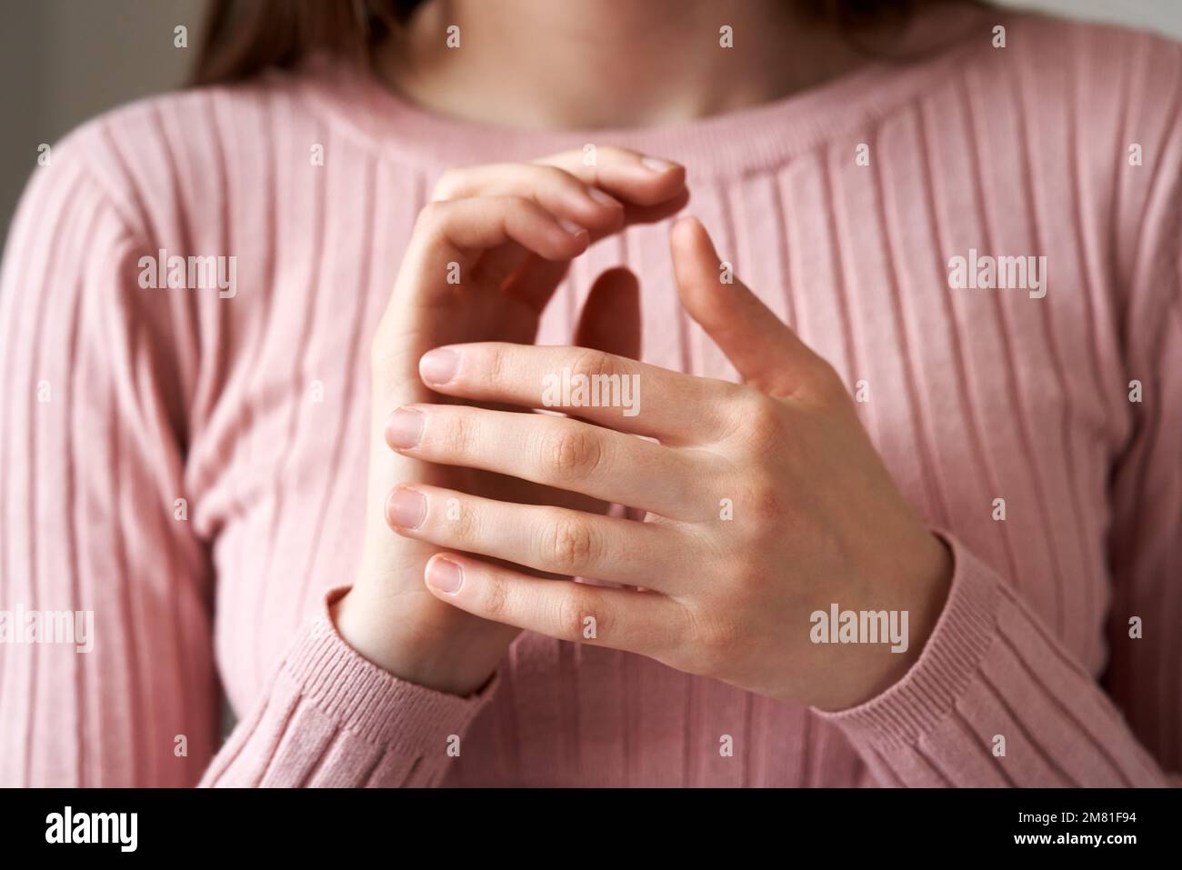 Young girl practicing EFT or emotional freedom technique - tapping on ...