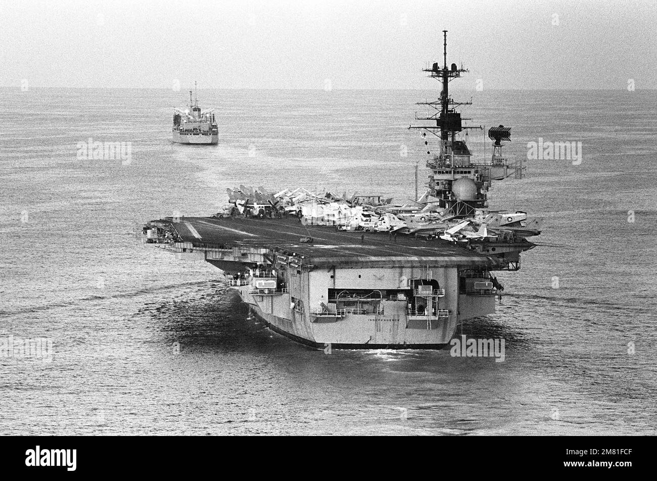 Aerial stern view of the aircraft carrier USS INDEPENDENCE (CV 62). The ...