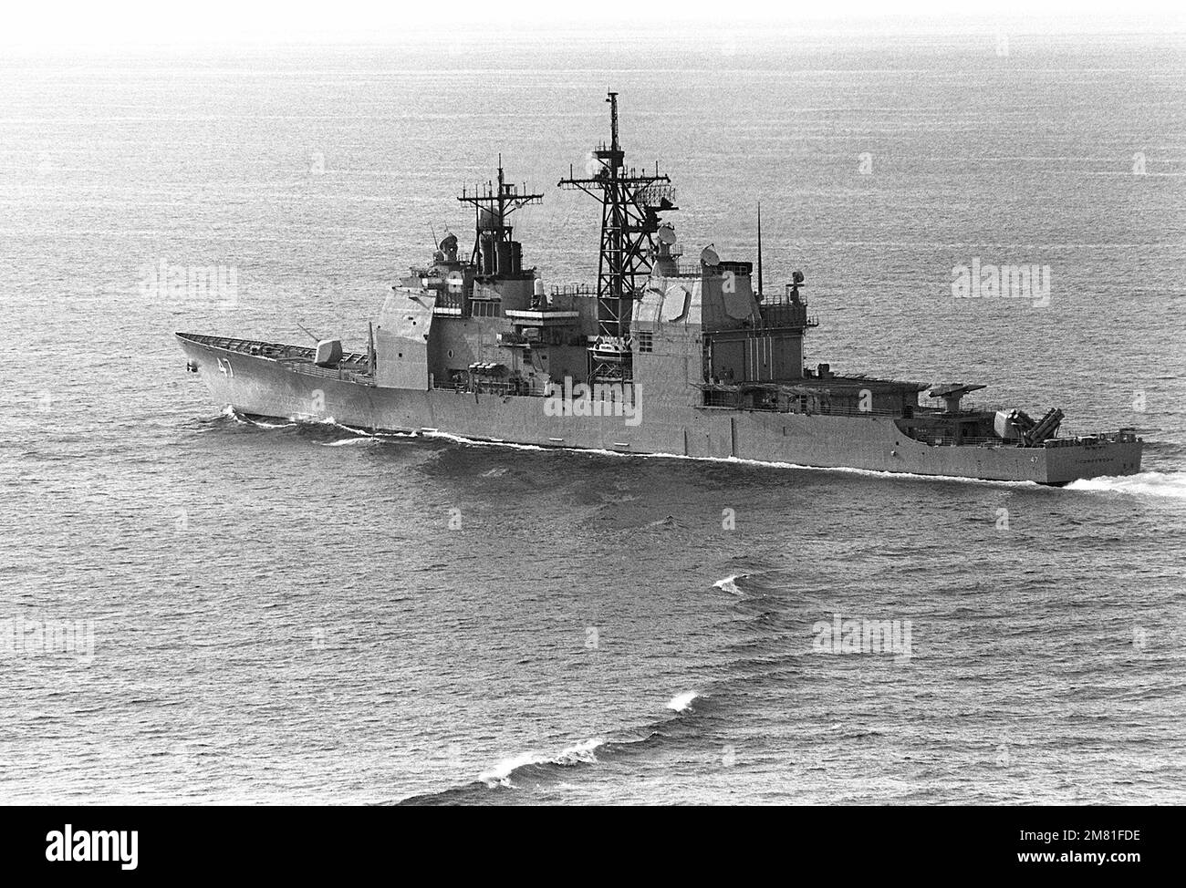 An aerial port quarter view of the Aegis guided missile cruiser USS ...