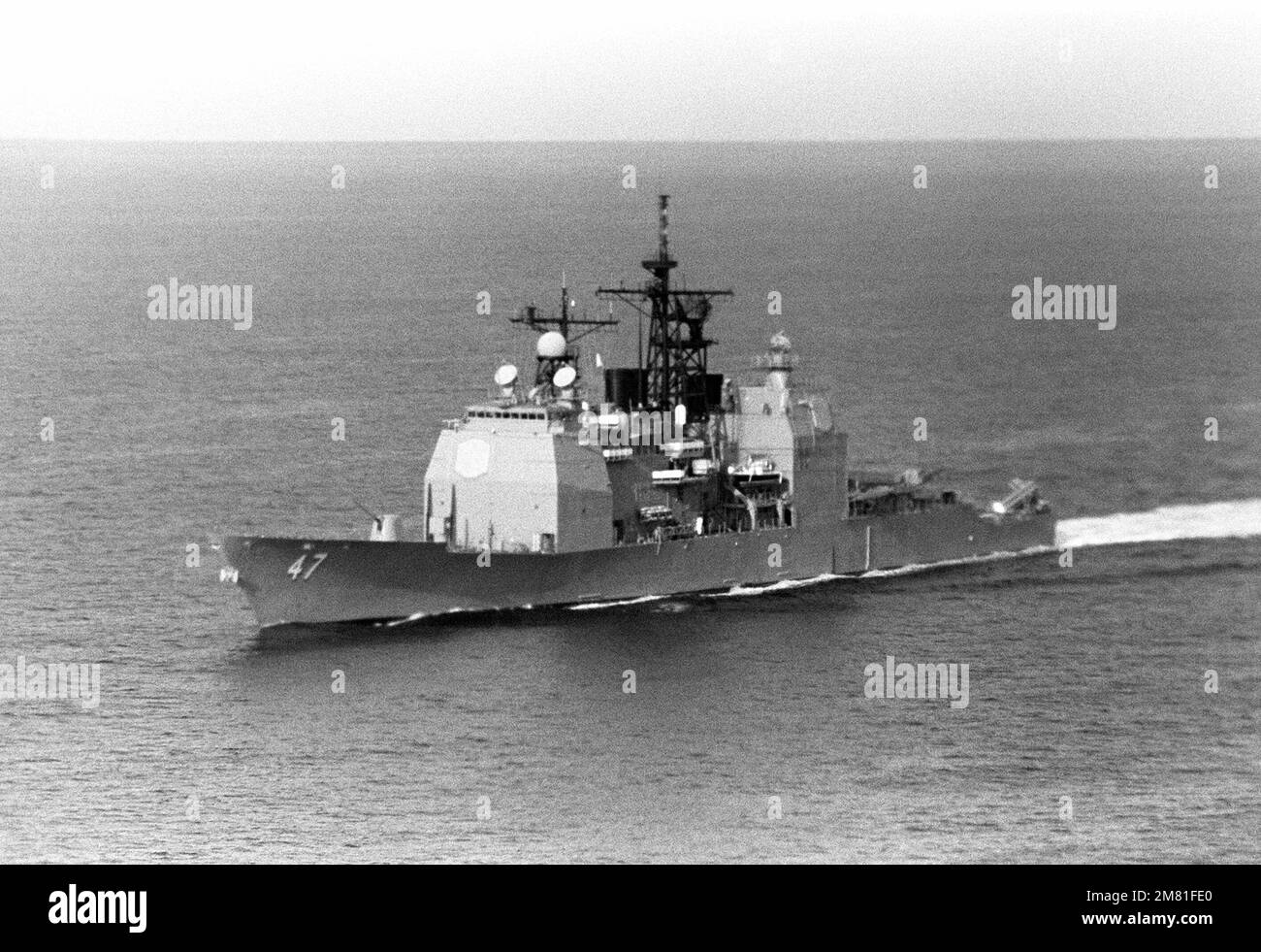 An aerial port bow view of the Aegis guided missile cruiser USS ...