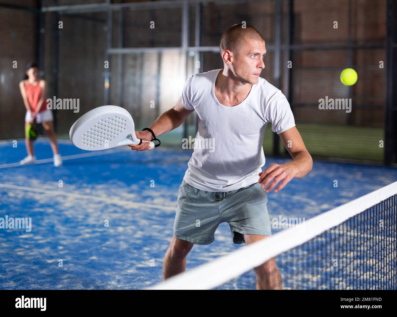 Man playing padel tennis on padel court Stock Photo - Alamy