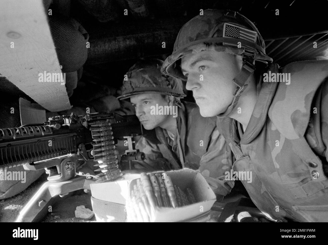A Marine M60 machine gun crew stands guard in a bunker at Beirut ...