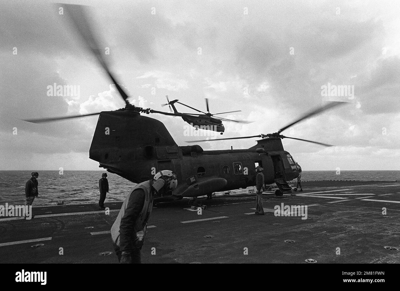 A right side view of a CH-46 Sea Knight helicopter on the flight deck ...