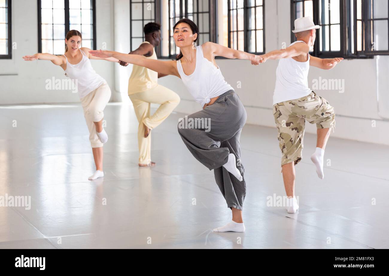 Four dancers exercising swing movements Stock Photo - Alamy