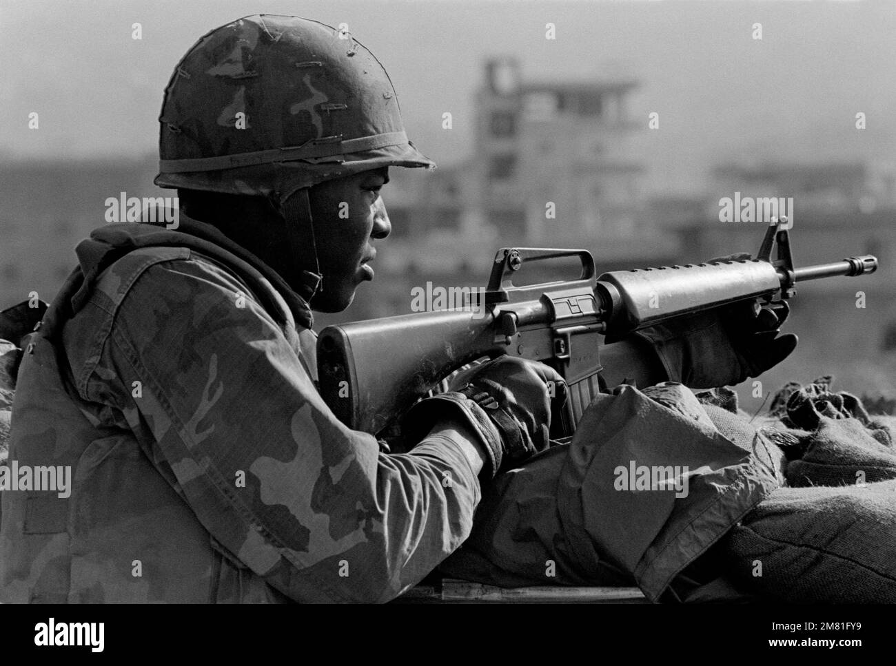 A Marine armed with an M16 rifle stands guard in a bunker at Beirut ...