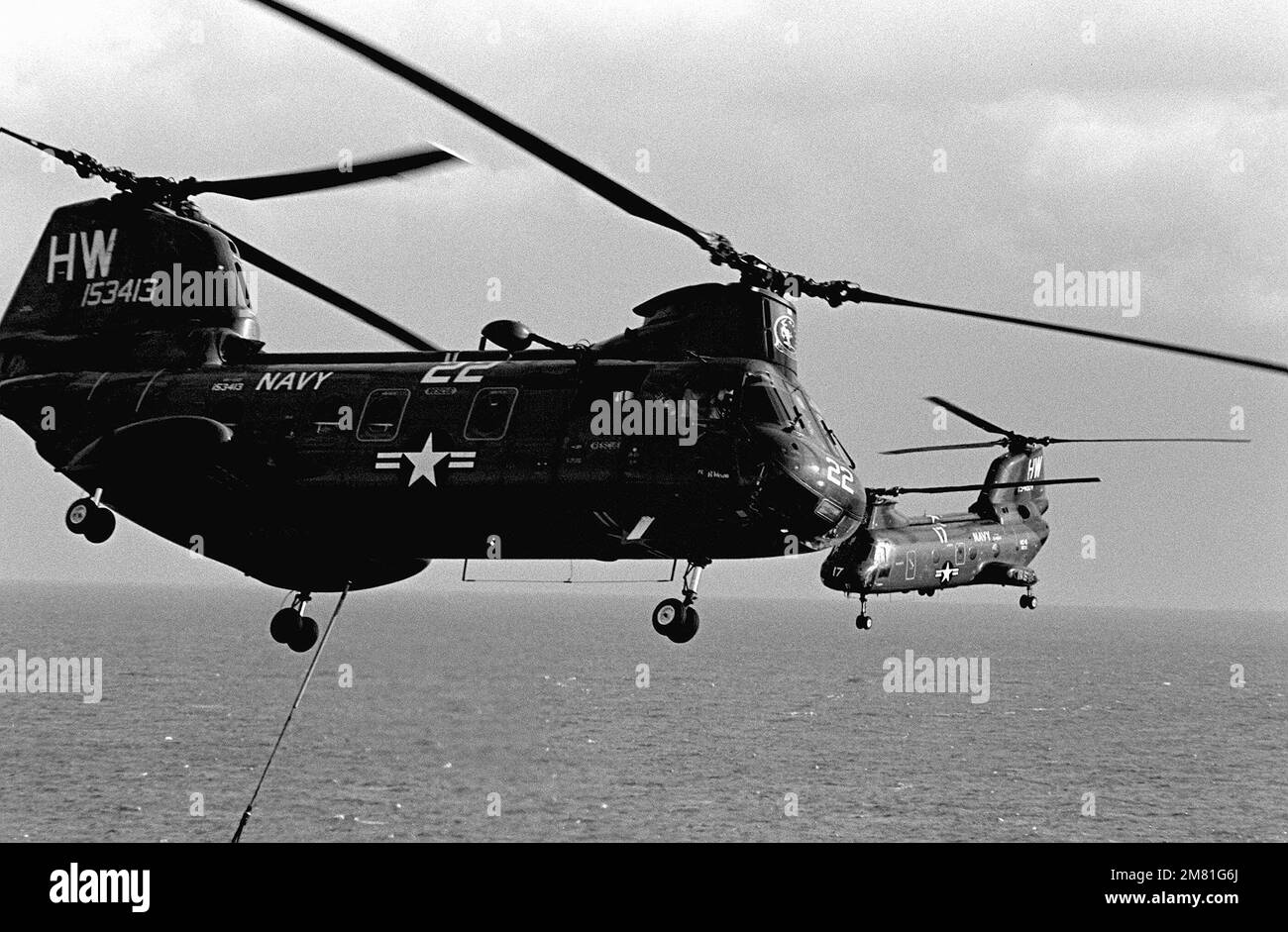 A view of two UH-46 Sea Knight helicopters providing replenishment ...