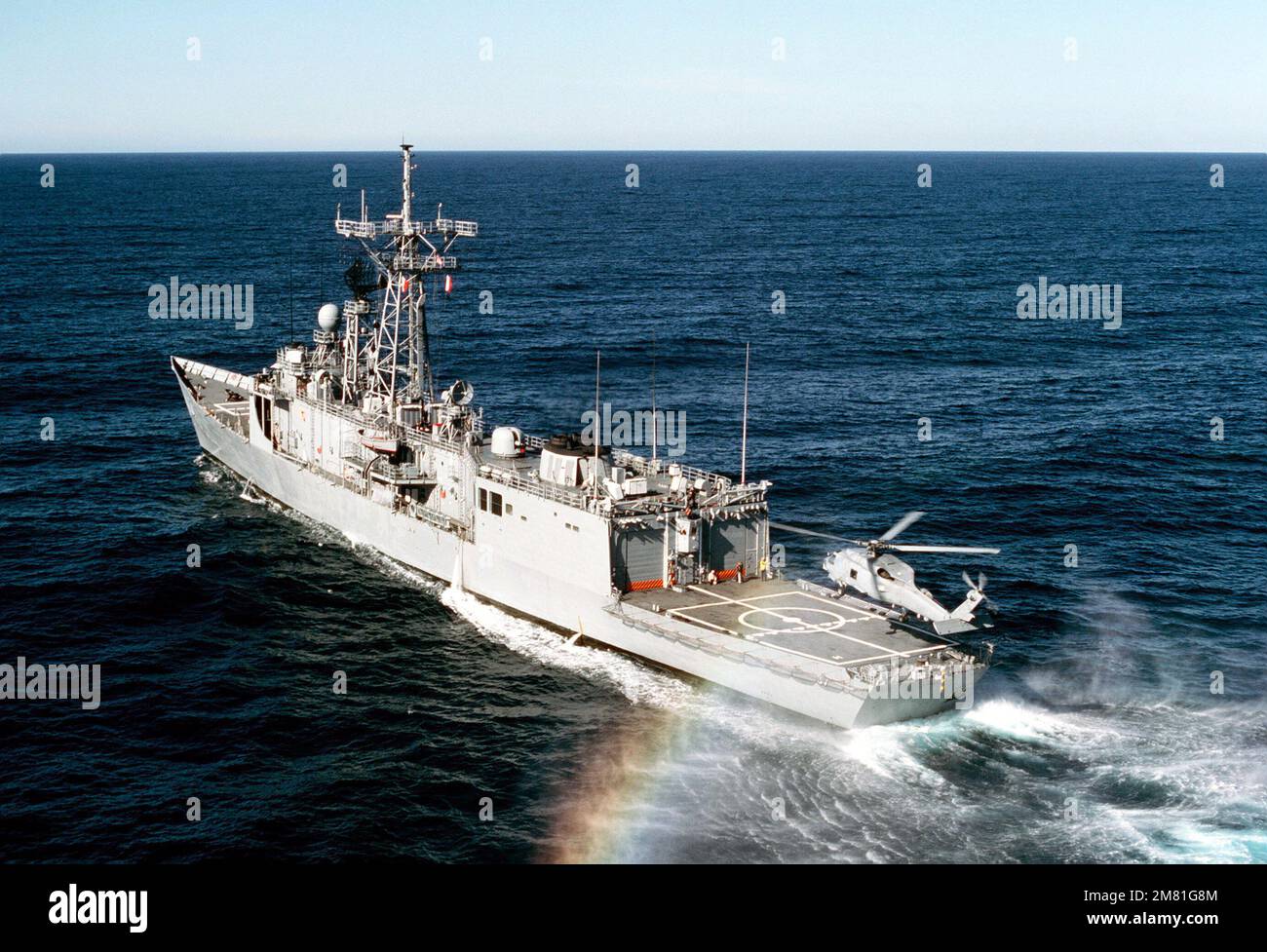 A port quarter view of the guided missile frigate USS CROMMELIN (FFG 37 ...