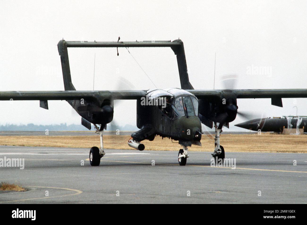 An OV-10 Bronco aircraft taxis out in preparation for takeoff during ...