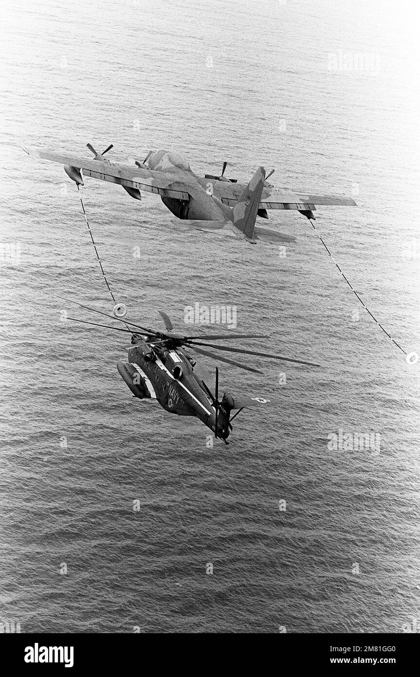 An air-to-air view of a CH-53E Sea Stallion helicopter during refueling ...