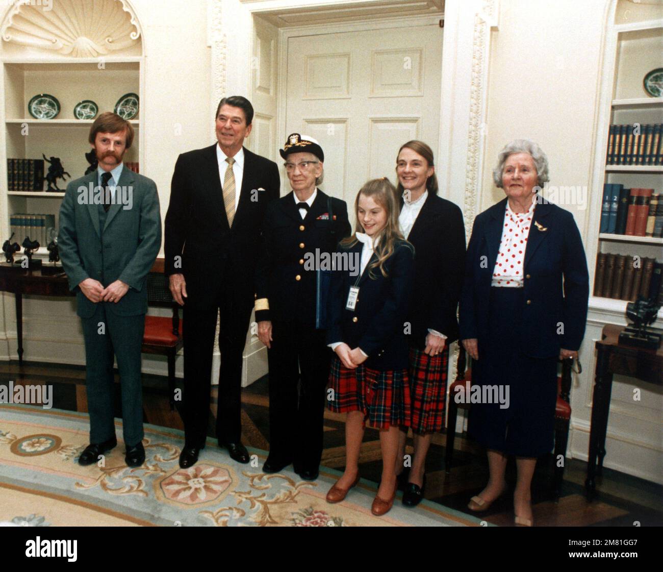 Commodore Grace Hopper (center) stands with President Ronald Reagan and ...