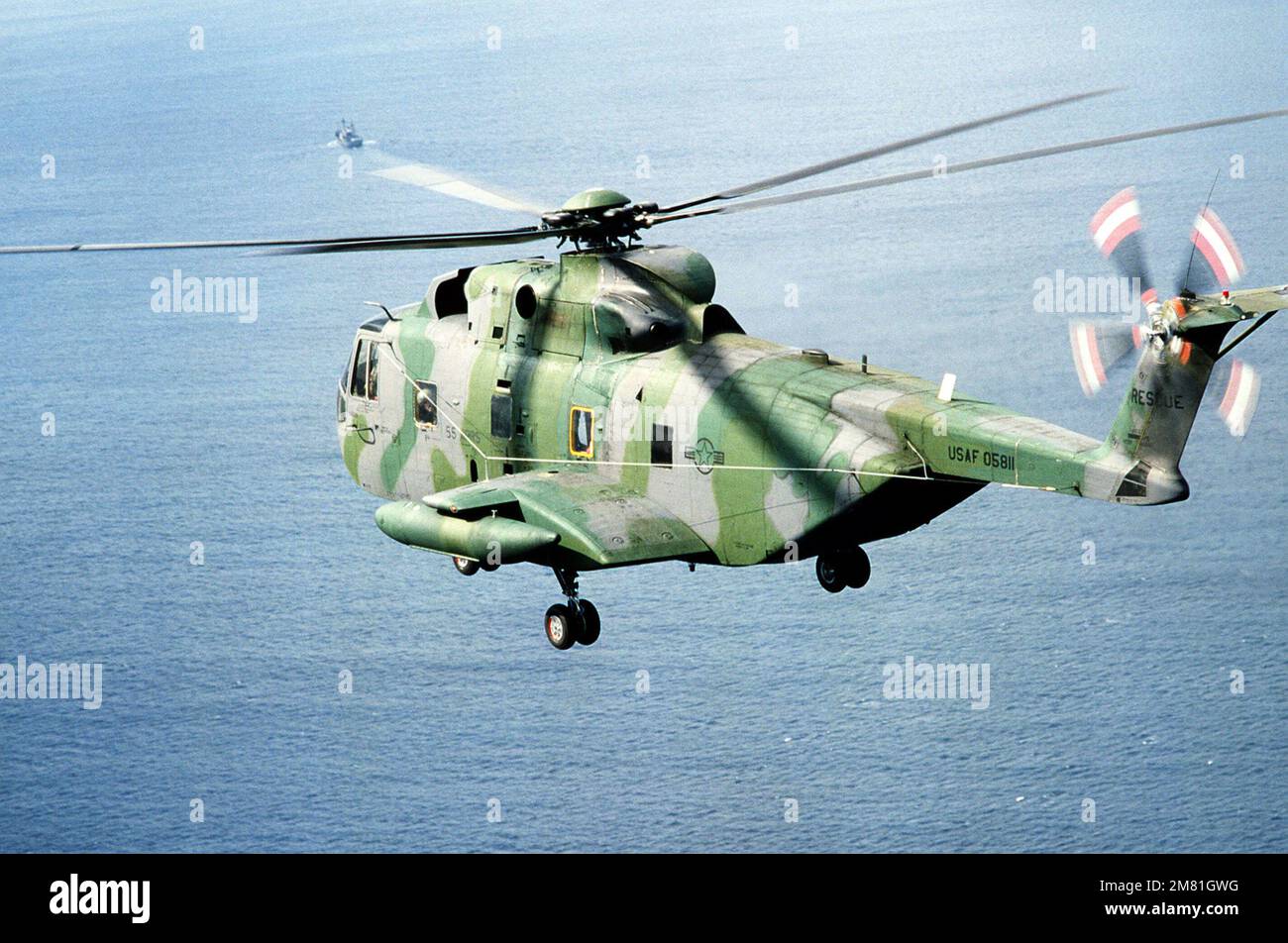An air-to-air left rear view of a CH-3 Jolly Green Giant helicopter ...
