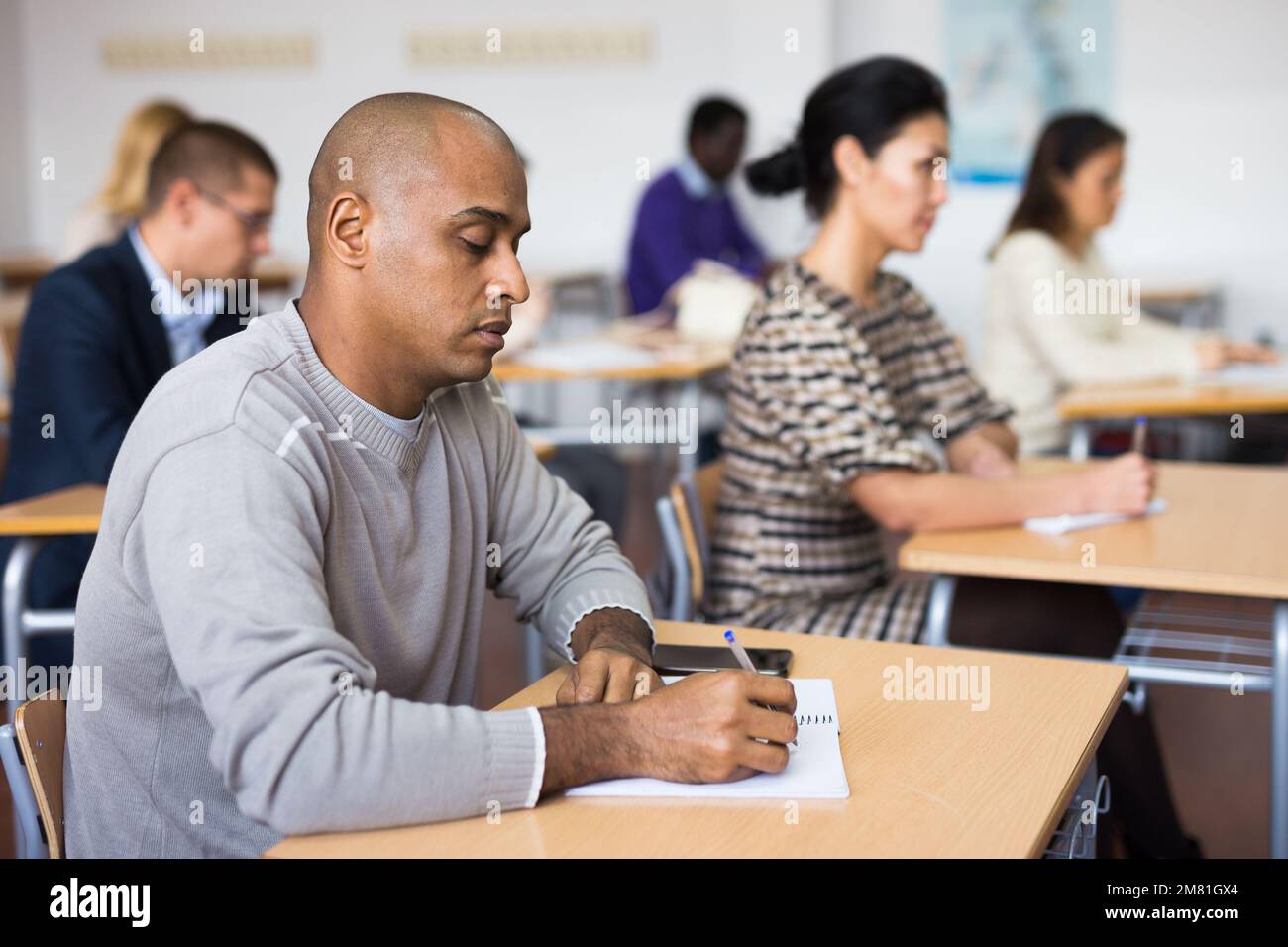 Portrait focused man writing hi-res stock photography and images - Alamy
