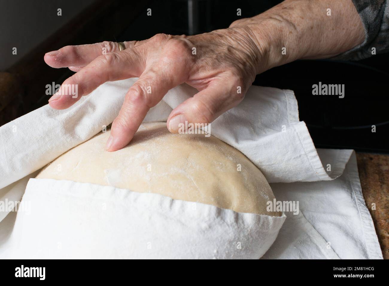 Human hand checking rising of yeast dought. Black background Stock ... Human hand checking rising of yeast dought. Black background Stock ...