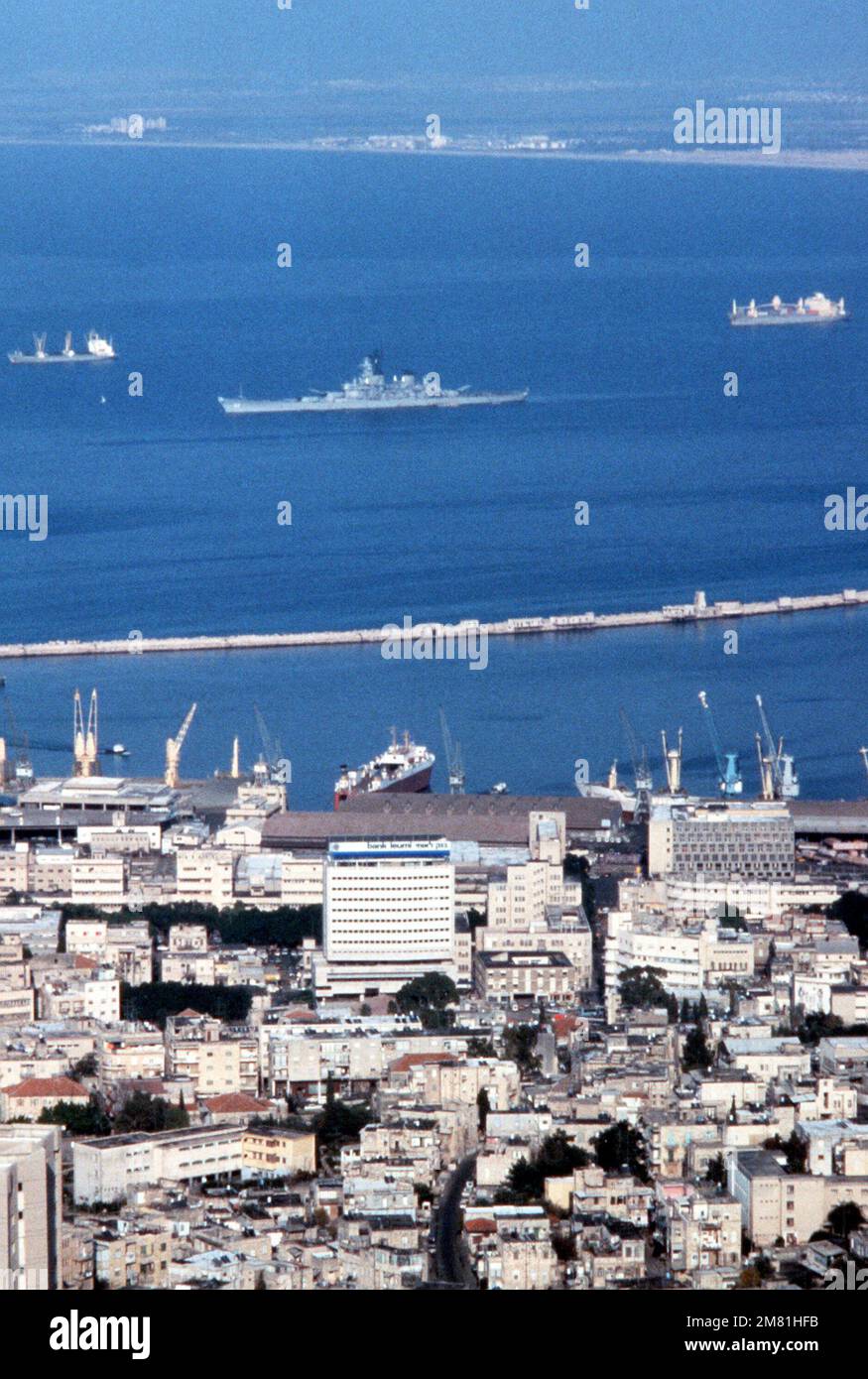 A view of the battleship USS NEW JERSEY (BB 62) anchored in the harbor ...