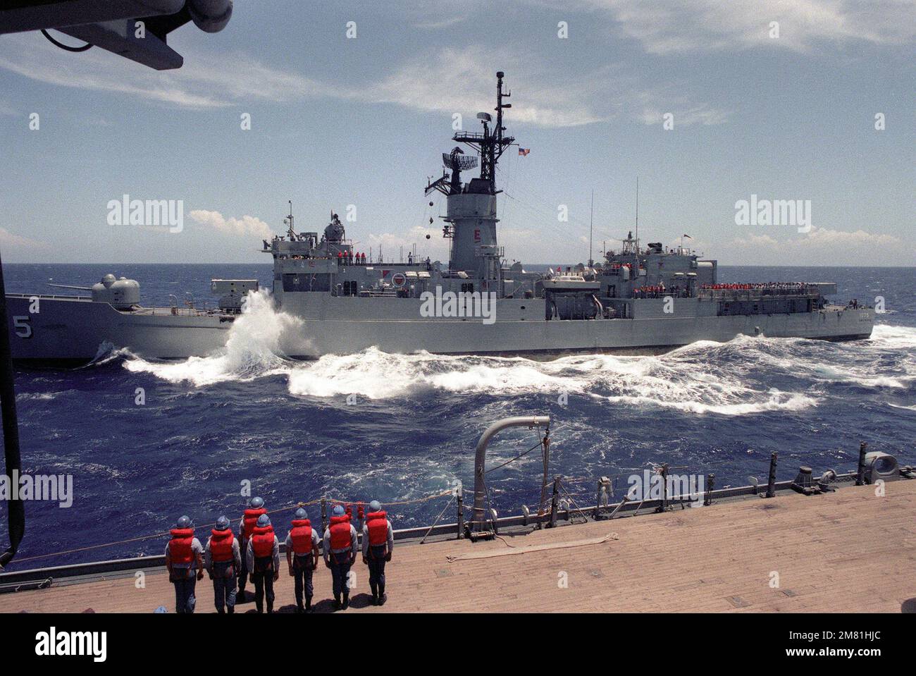 The frigate USS TRIPPE (FF-1075) comes alongside the battleship USS ...