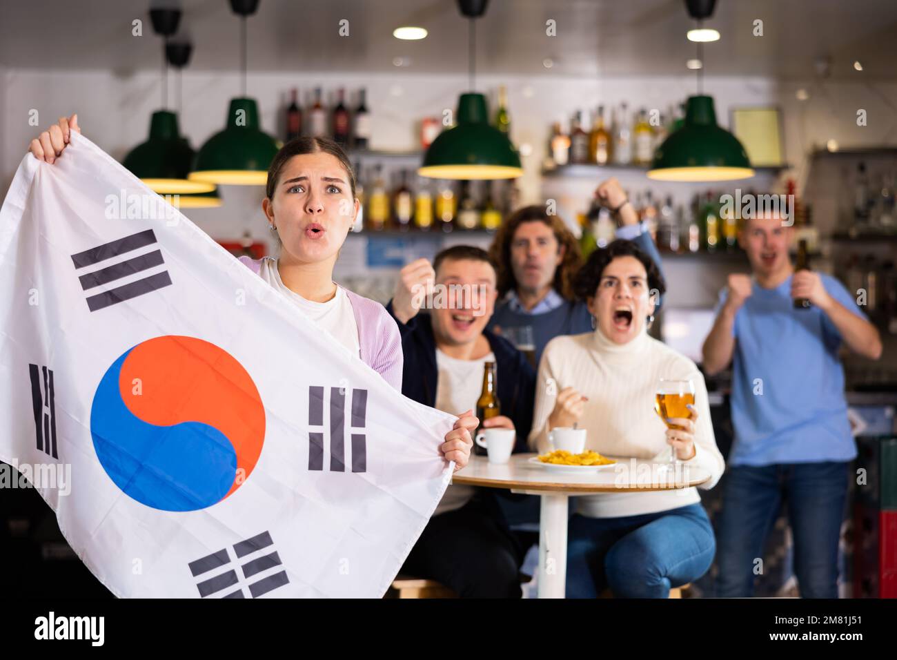 Company of young adult fans supporting team of South Korea with state ...