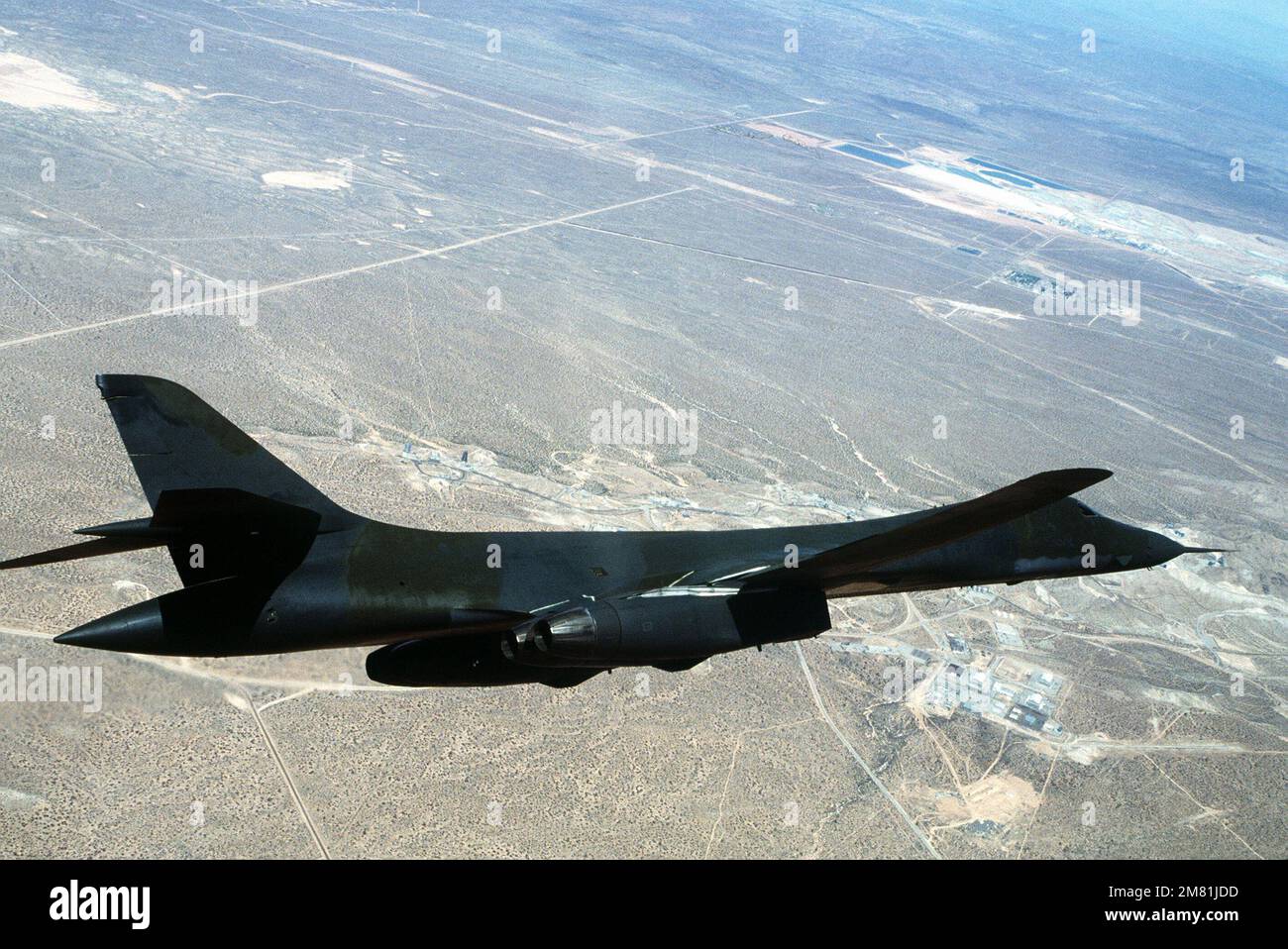 An air-to-air right side view of a B-1B Testbed aircraft (originally ...